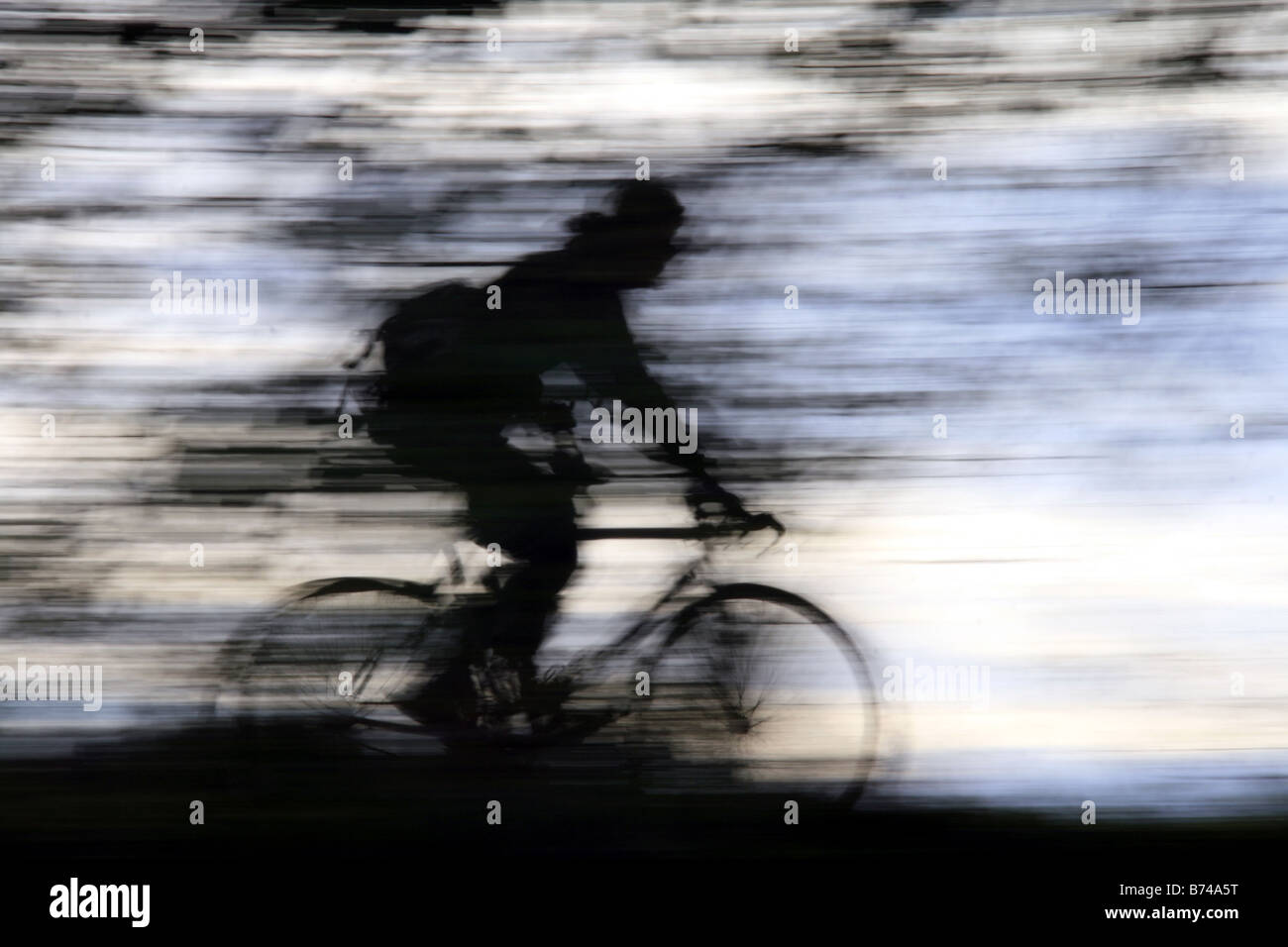 Park morning light man on bike hi-res stock photography and images - Alamy