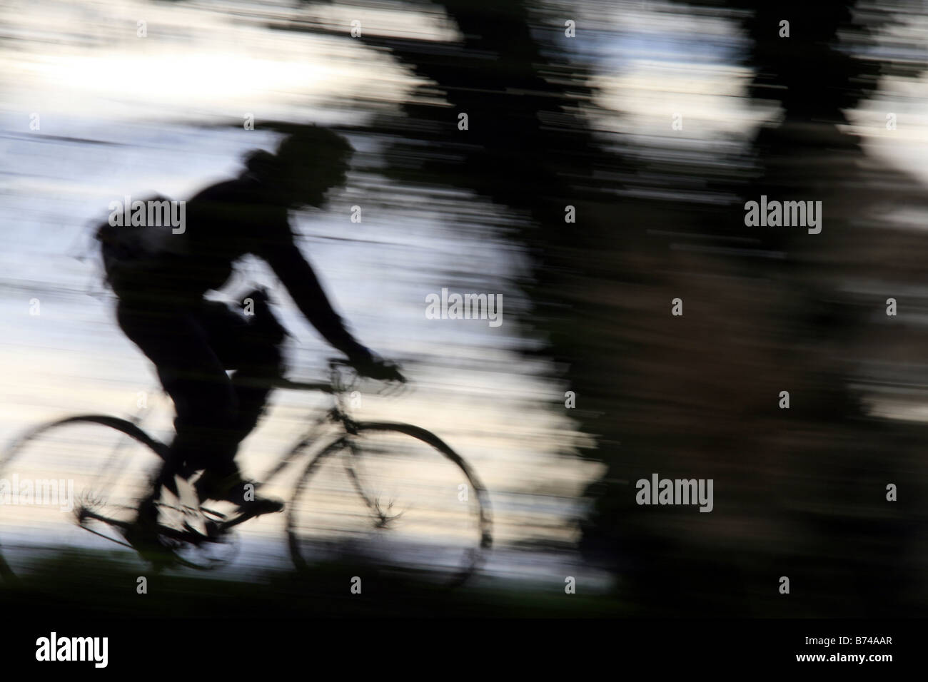 person riding fast bike on rural lane countryside Stock Photo - Alamy