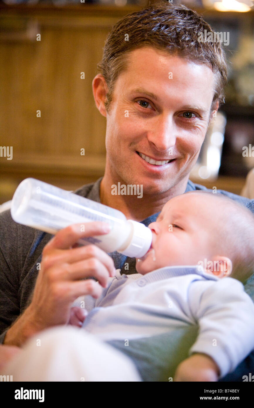 Father feeding baby Stock Photo - Alamy