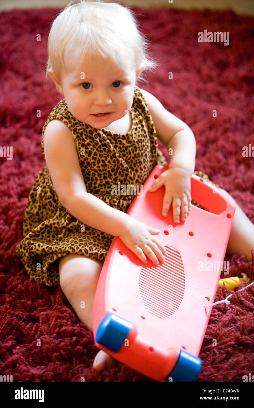 Baby girl sitting up toys hi-res stock photography and images - Alamy