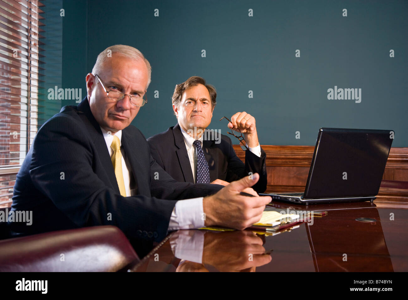 Meeting two men senior serious table hi-res stock photography and ...