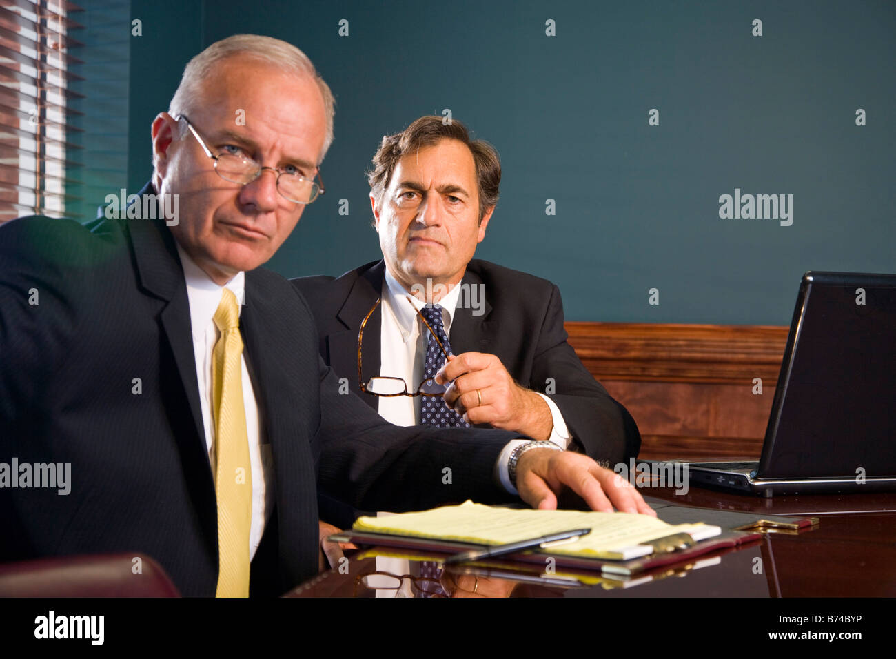 Meeting two men senior serious table hi-res stock photography and ...
