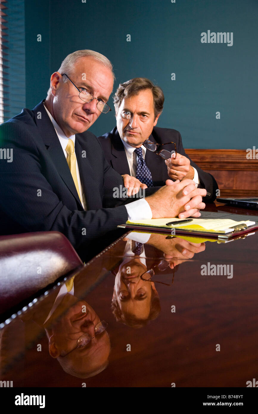 Meeting two men senior serious table hi-res stock photography and ...