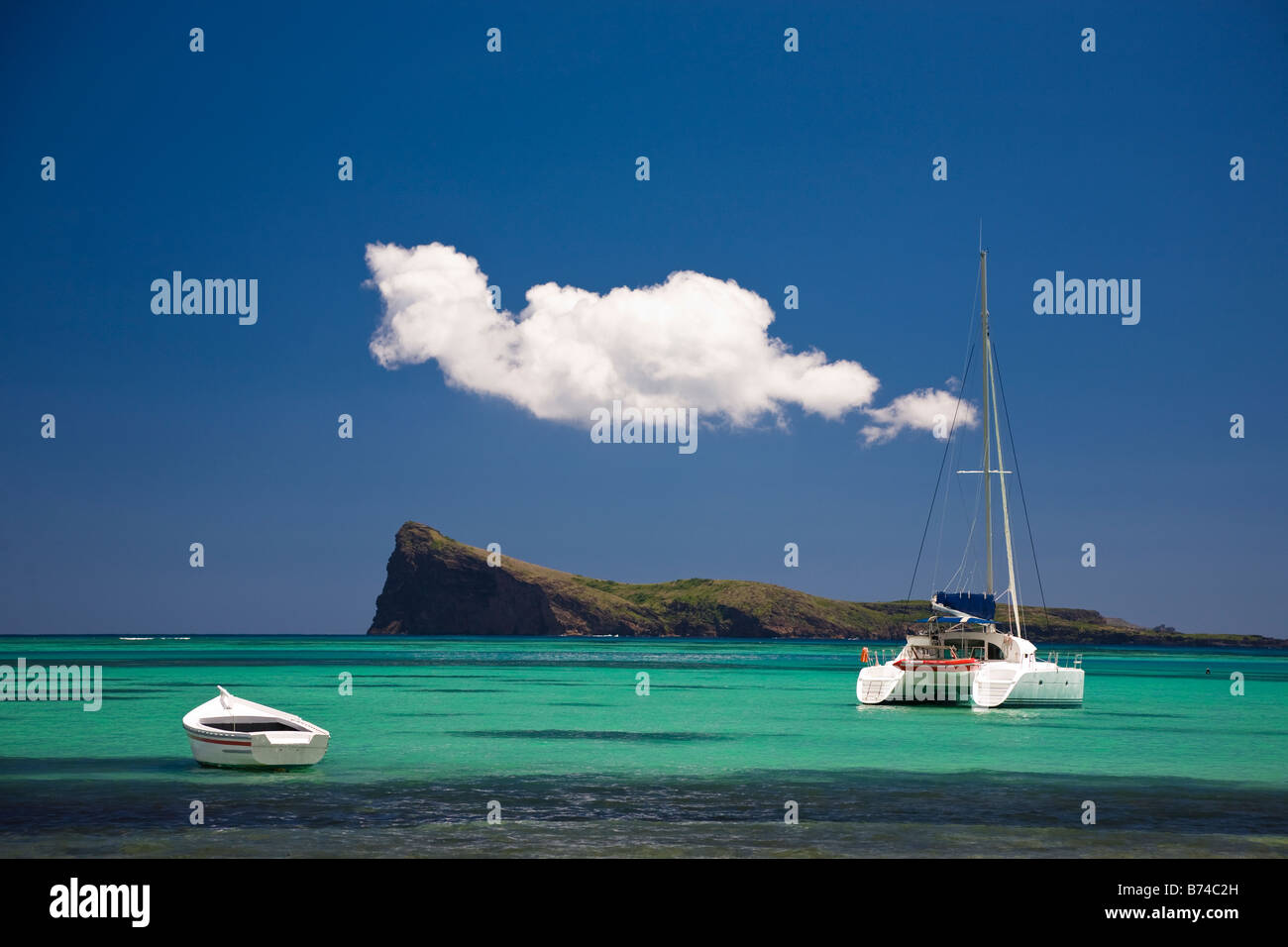 Boats berthed in the bay opposite the island of Coin de Mire also known ...