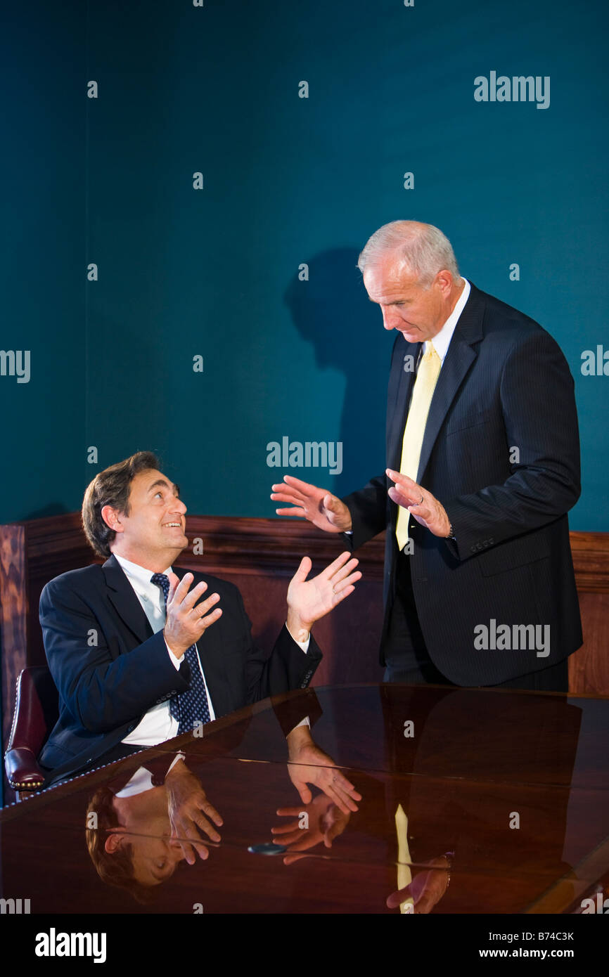 Two executives having discussion in conference room Stock Photo - Alamy