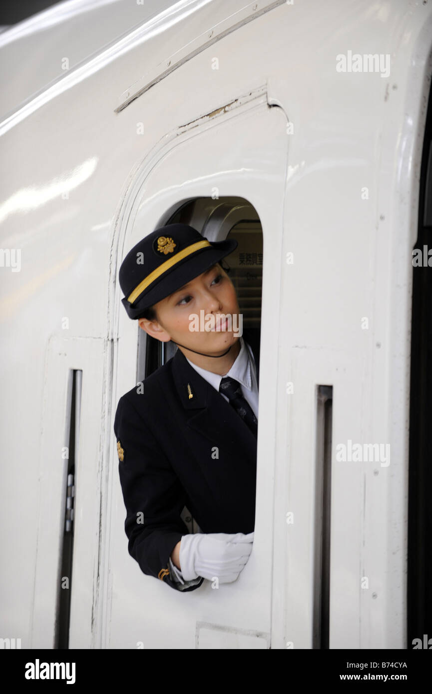 A female train guard on the Shinkansen bullet train Stock Photo - Alamy