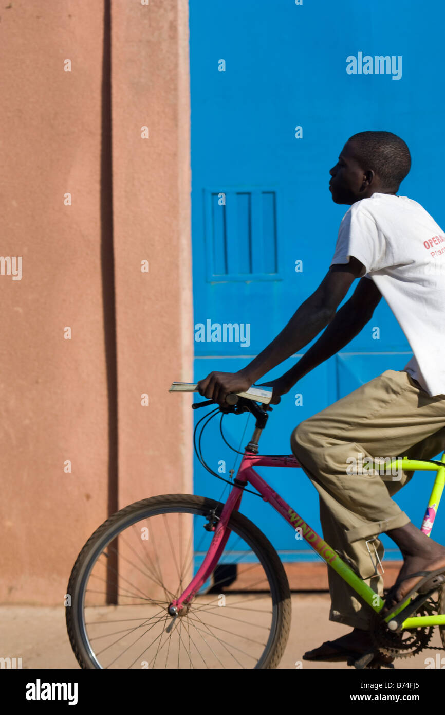 Man riding bike in Ouagadougou Stock Photo - Alamy