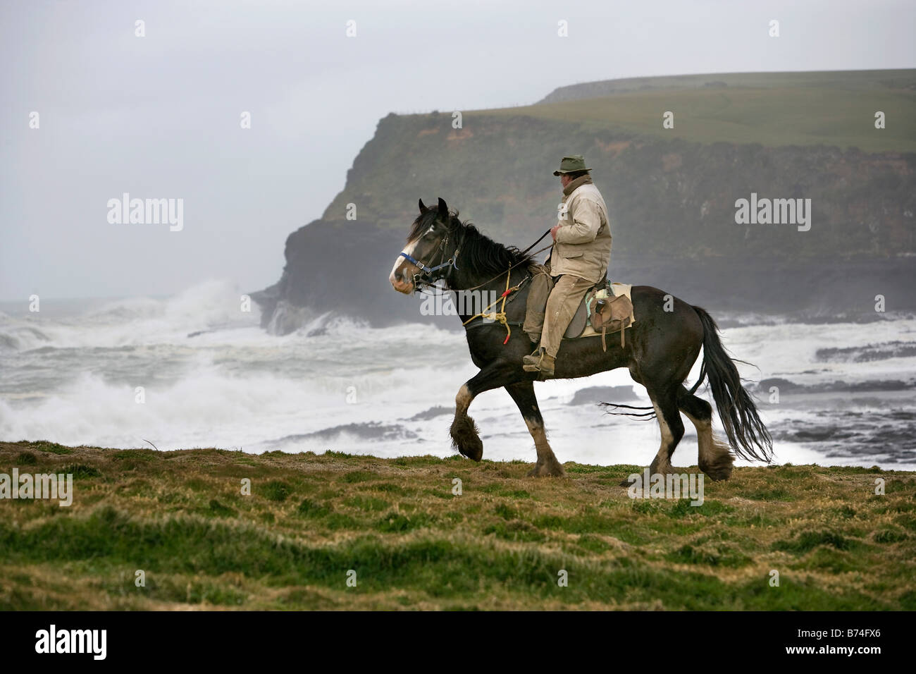 Riding horse in storm hi-res stock photography and images - Alamy