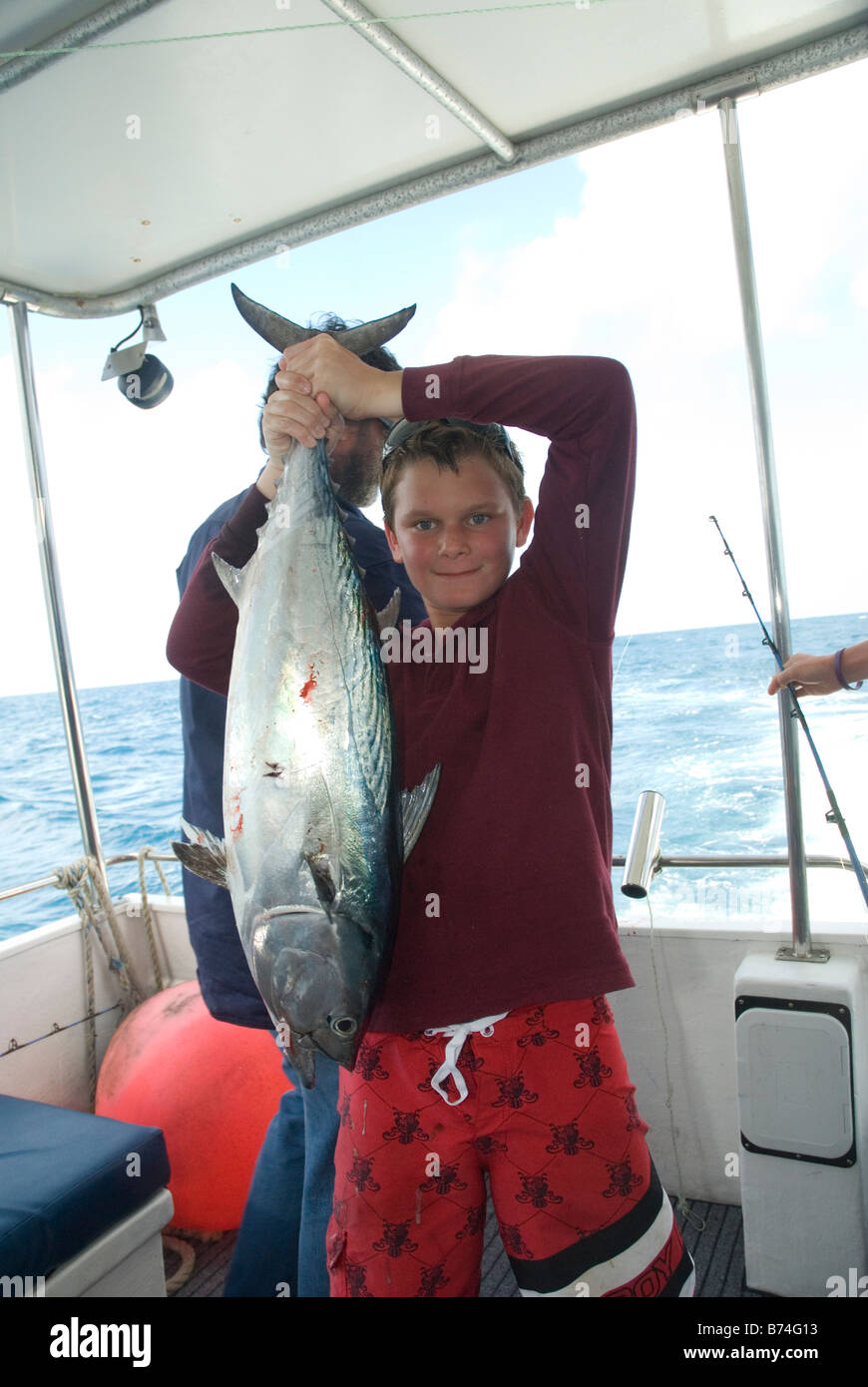 boy with Mack tuna Stock Photo - Alamy