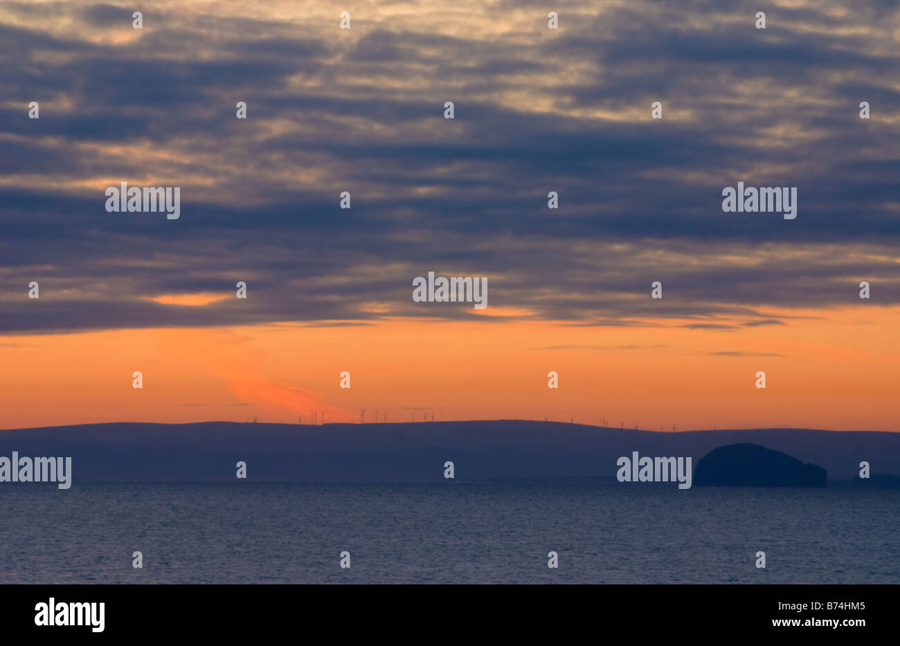 Sunrise behind Bass Rock an island bird sanctuary in the Firth of Forth ...