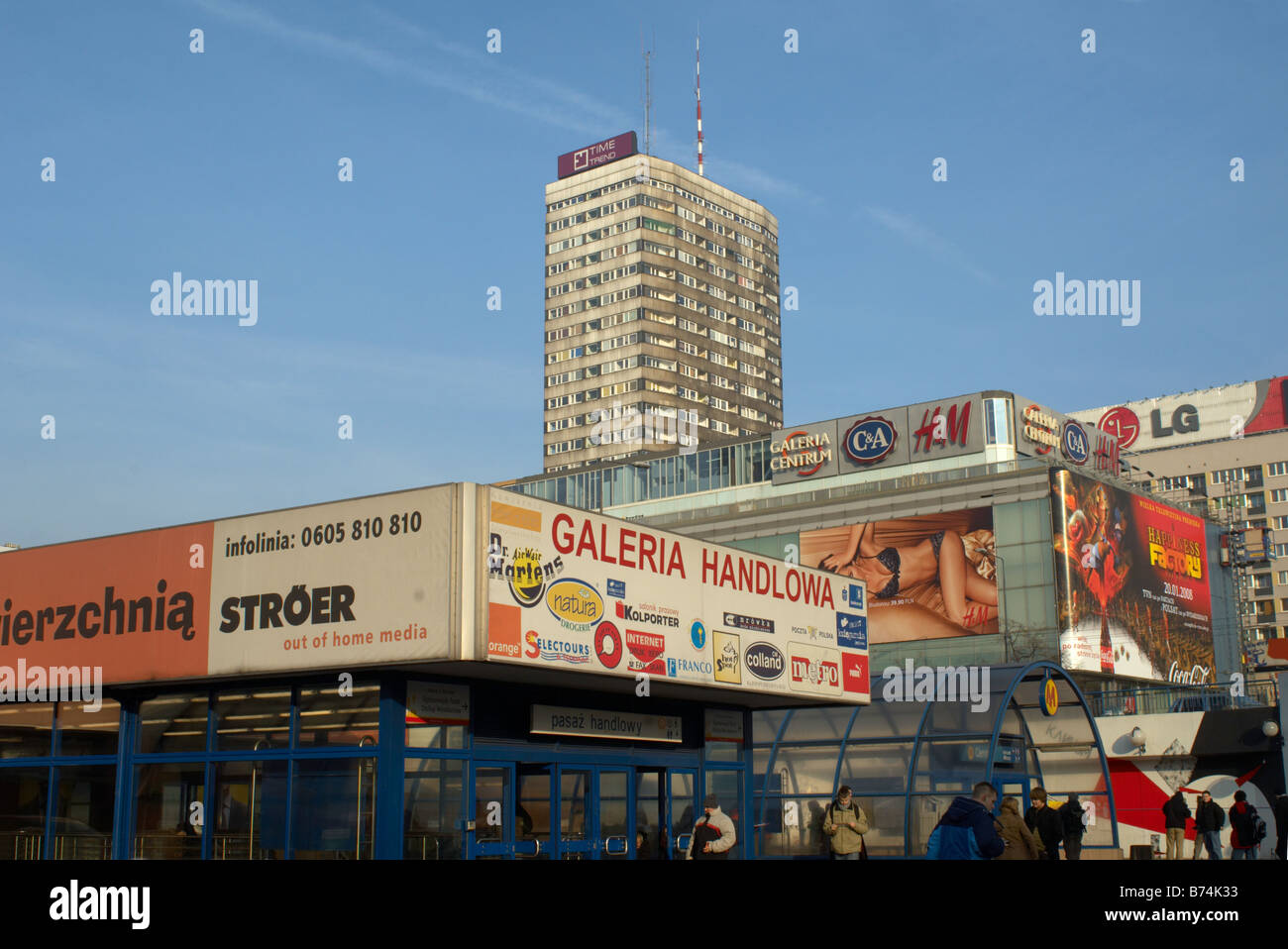 Buildings and appartment blocks jostle with shop signs and adverts in ...