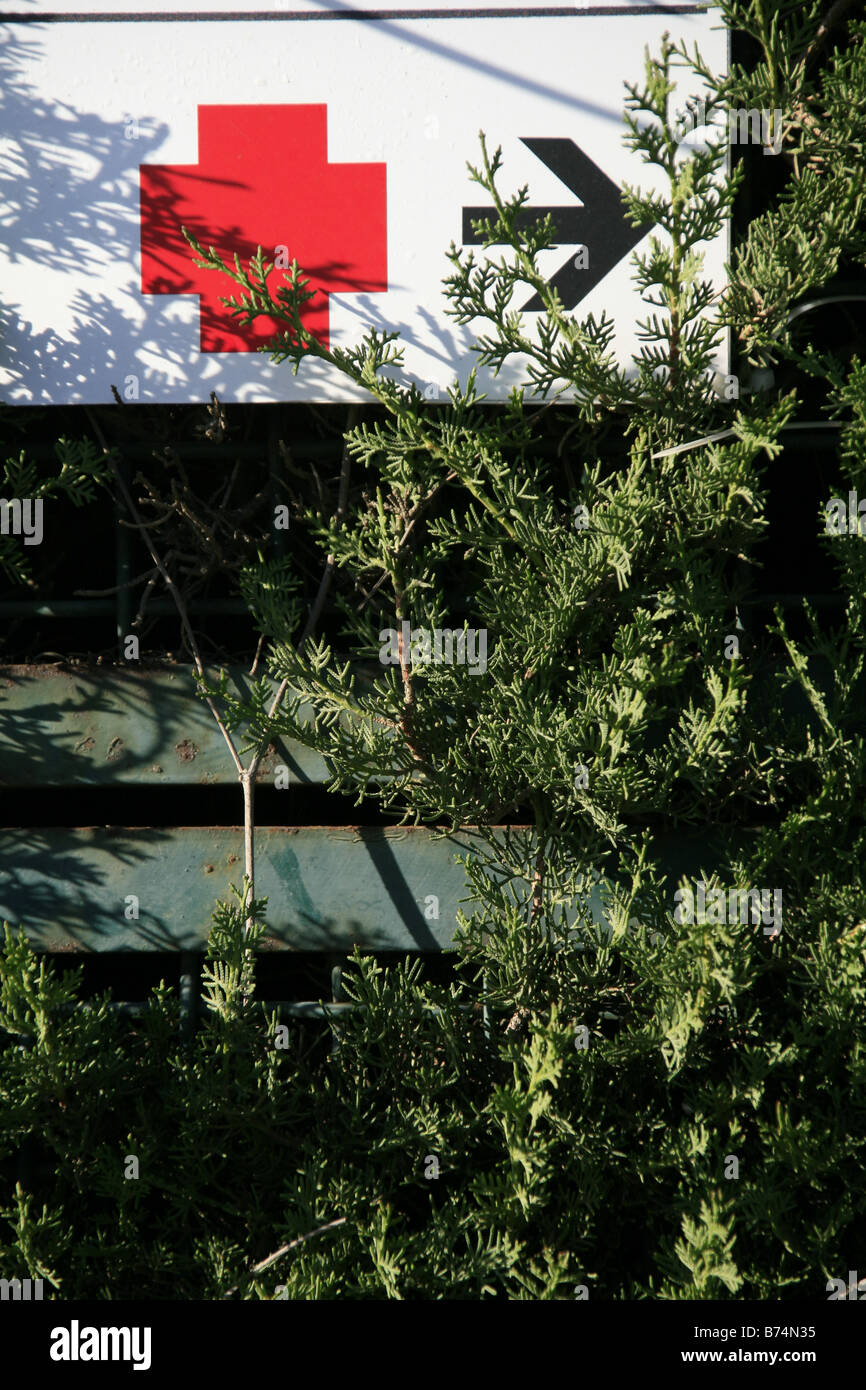 Sign notice arrow direction first aid point hospital tree wall hi-res ...