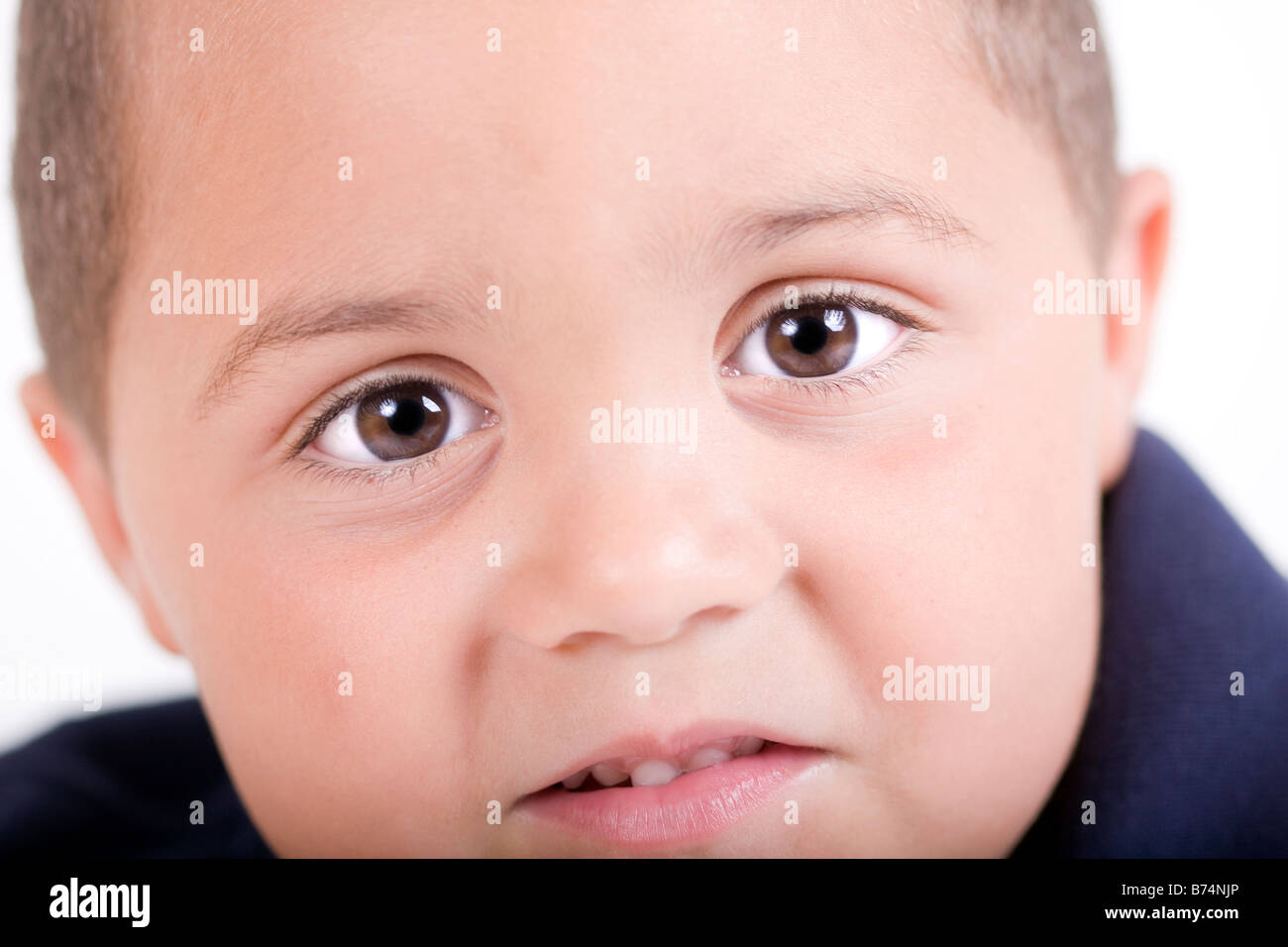 Closeup of a sad boy looking into camera Stock Photo - Alamy