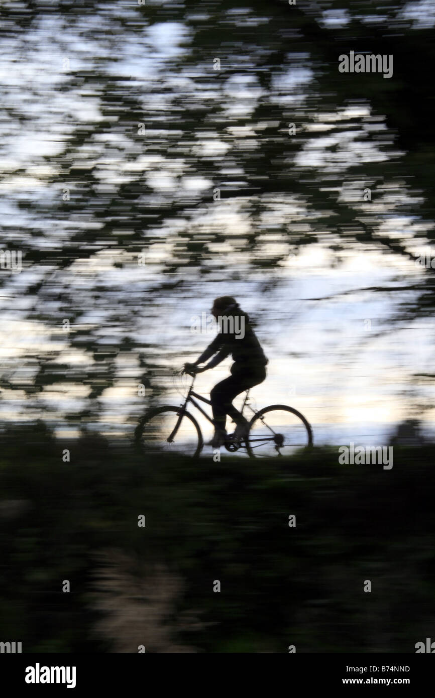 person riding fast bike on rural lane countryside Stock Photo - Alamy