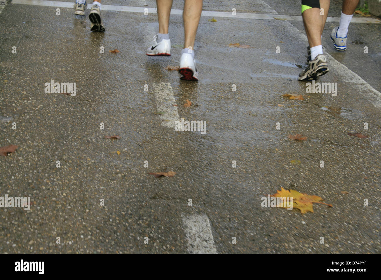 Three men run in the rain hi-res stock photography and images - Alamy