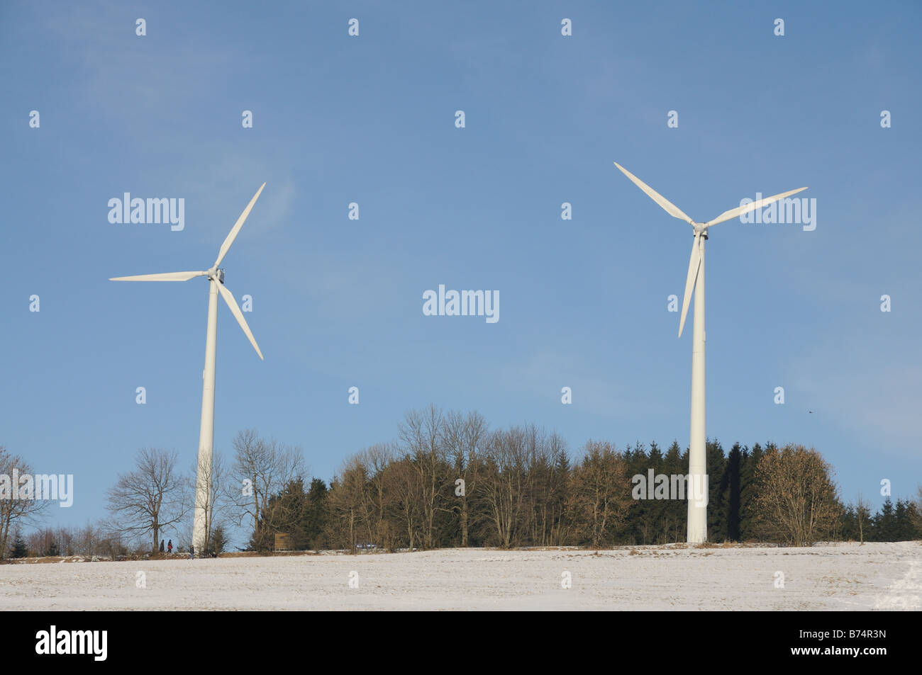 Two wind turbines in wintery landscape Stock Photo - Alamy