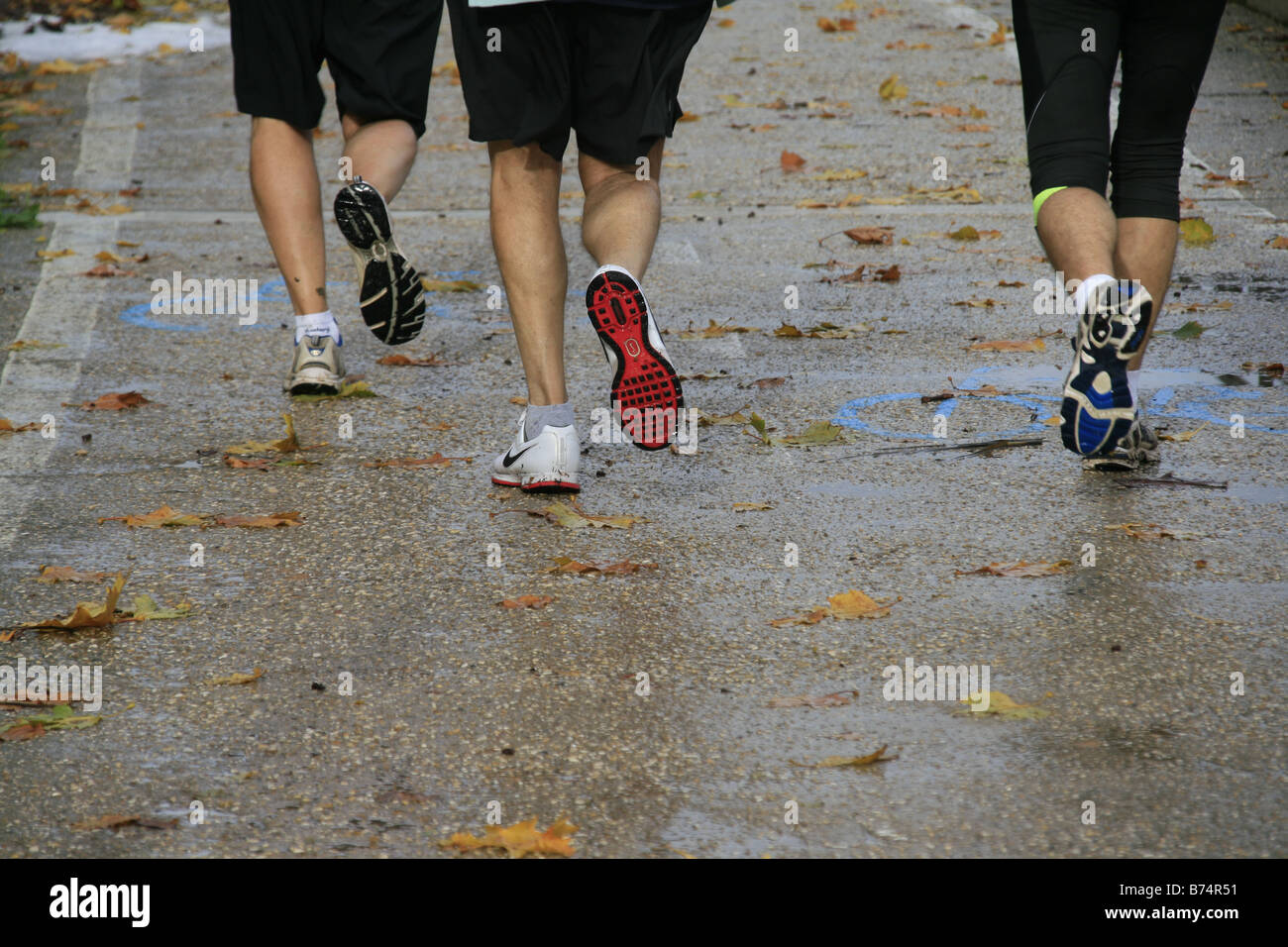 Three men run in the rain hi-res stock photography and images - Alamy