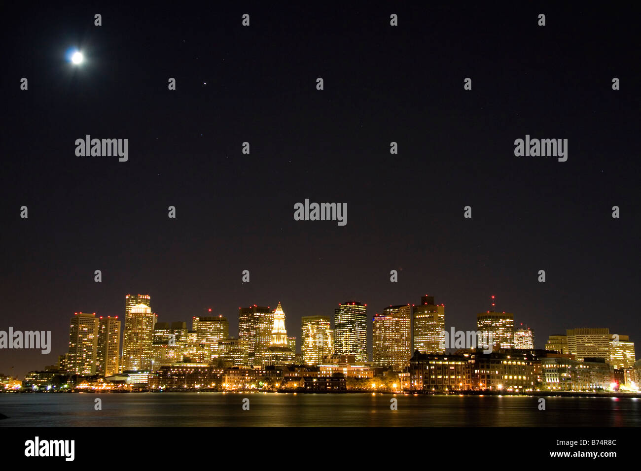 Boston skyline on a moonlight starry night with Boston Harbor in the ...