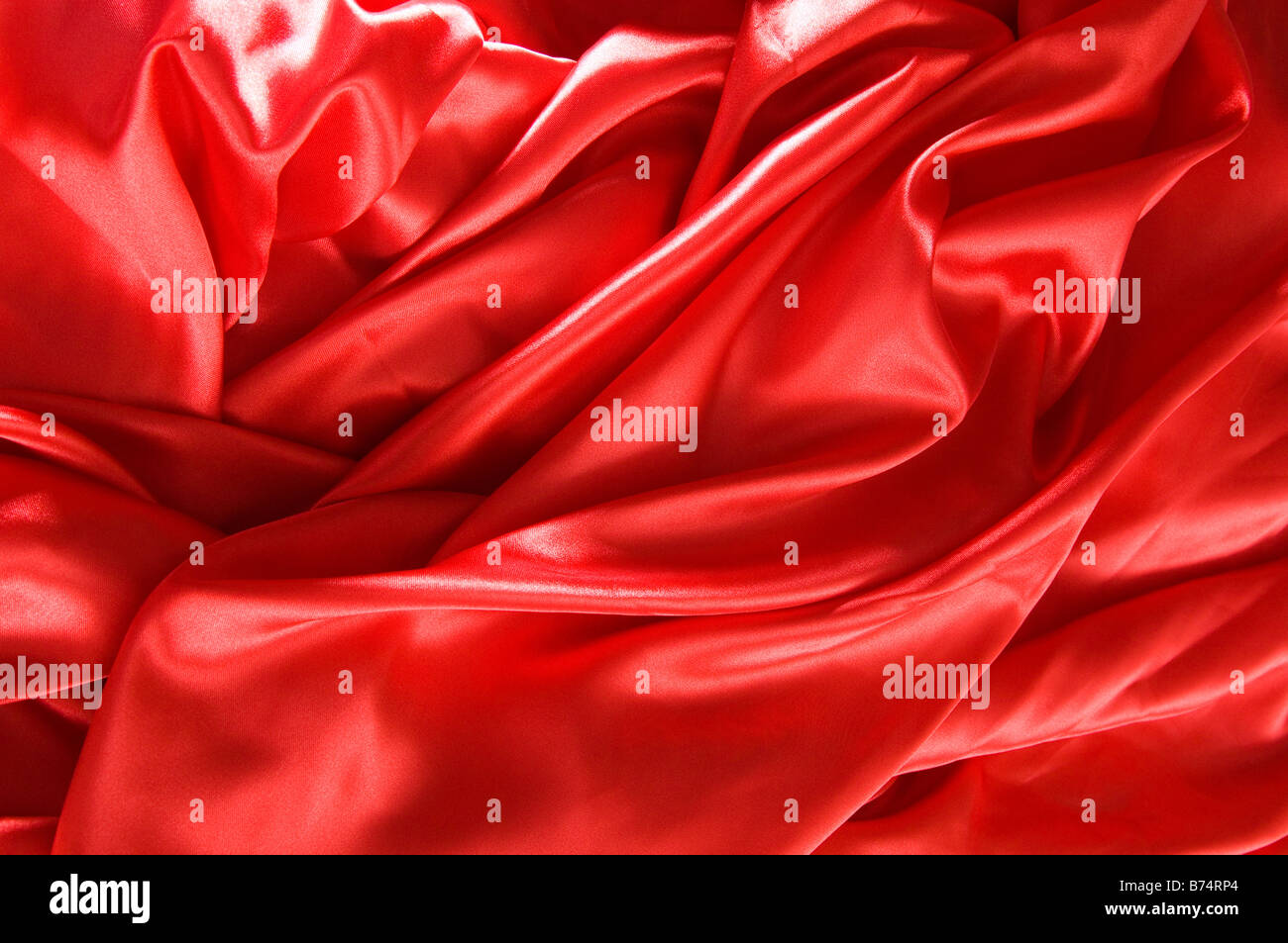 Close up or red satin fabric Stock Photo - Alamy