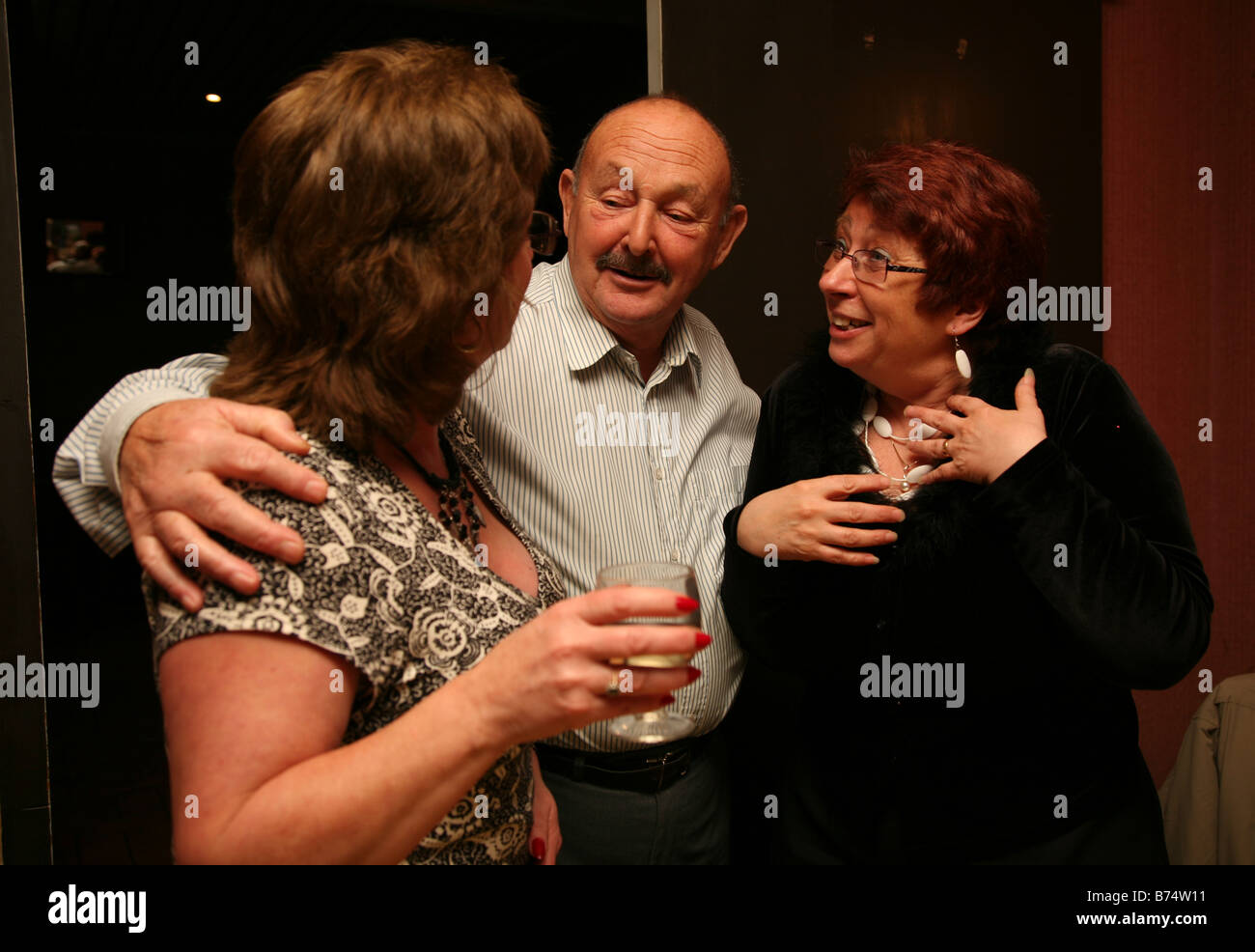 Group of adults enjoying a night out Stock Photo - Alamy