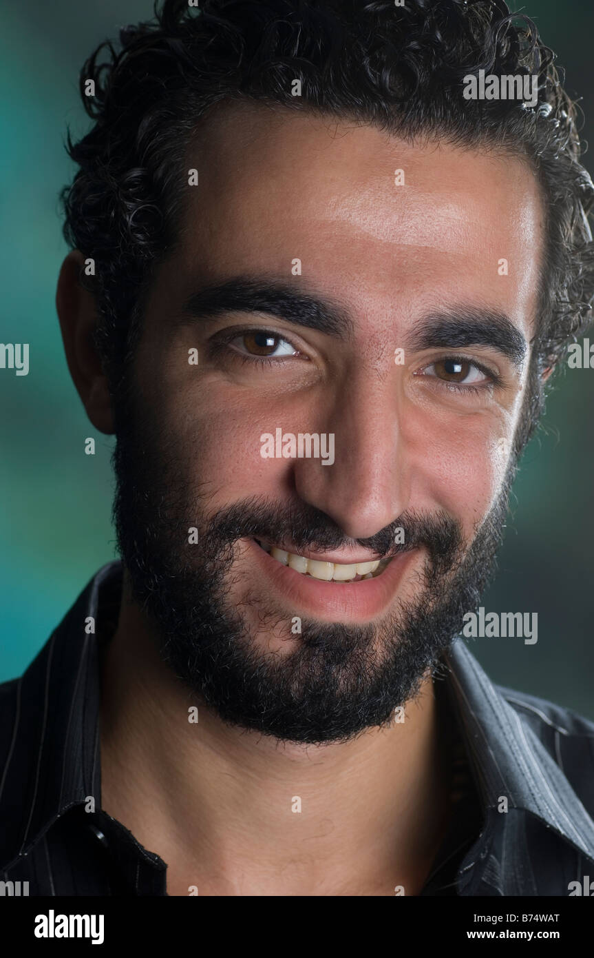 Portrait of a young Middle Eastern man smiling Stock Photo - Alamy