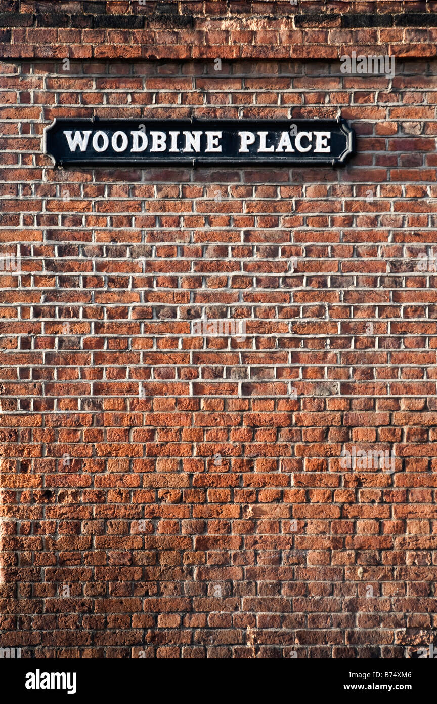 Brick wall and street sign hi-res stock photography and images - Alamy