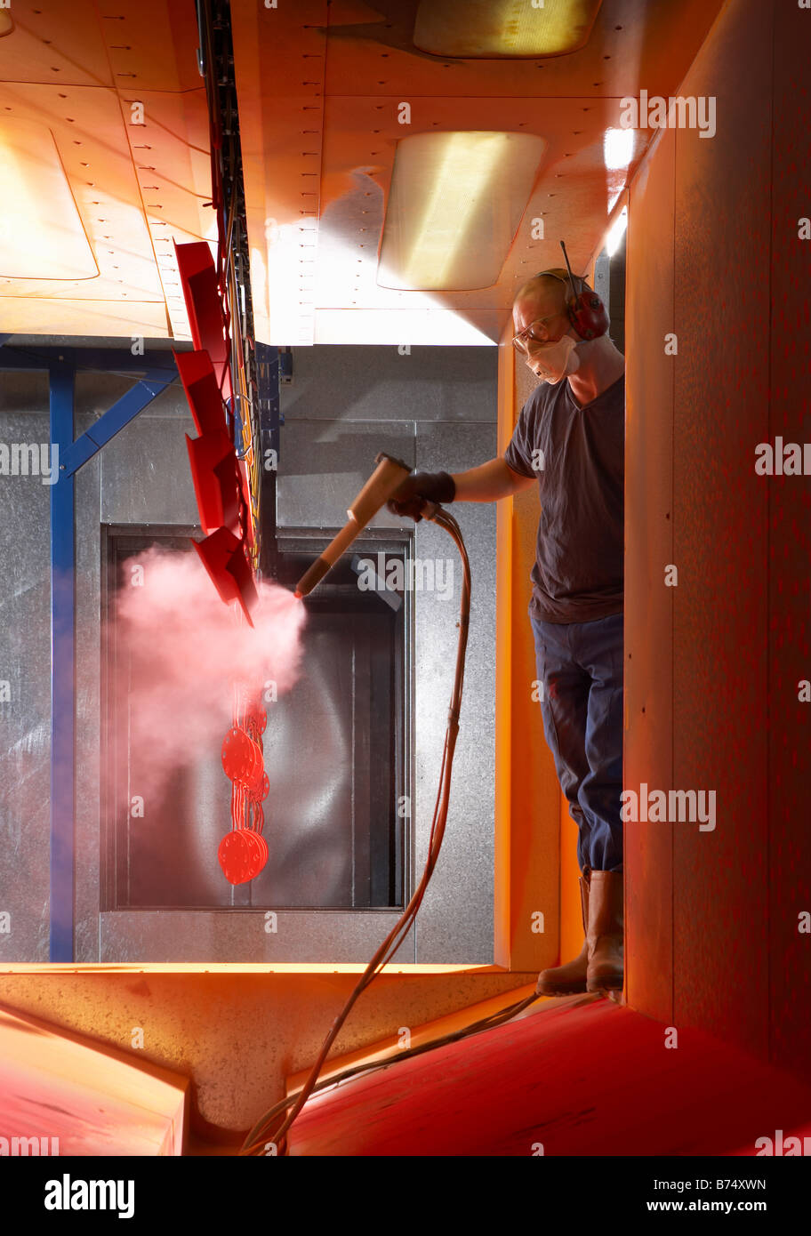 WORKER SPRAYING METALWORK IN INDUSTRIAL MANUFACTURING POWDER COATING ...