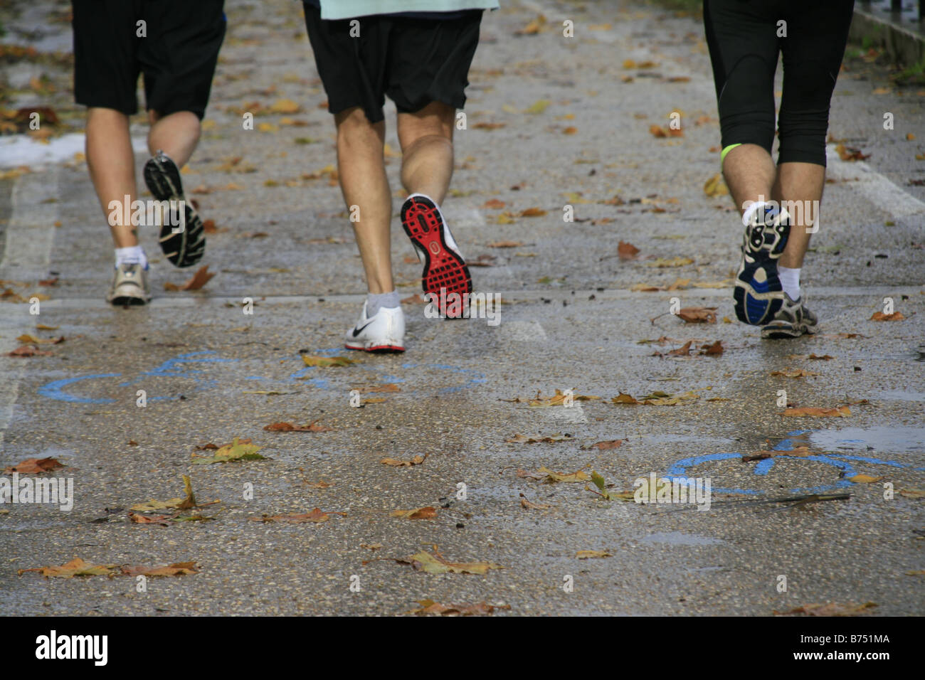 Three men run in the rain hi-res stock photography and images - Alamy