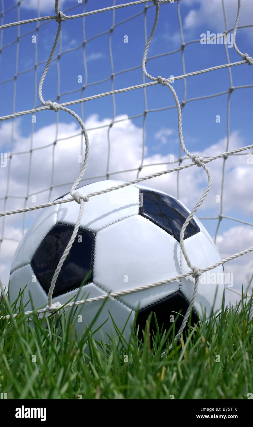 Soccer ball in the goal net Stock Photo - Alamy