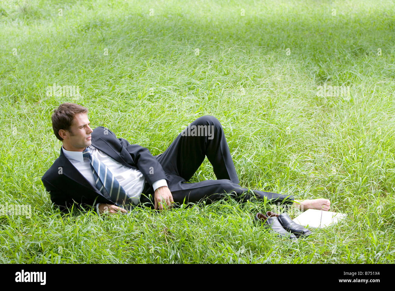 Mid adult man reclining hi-res stock photography and images - Alamy