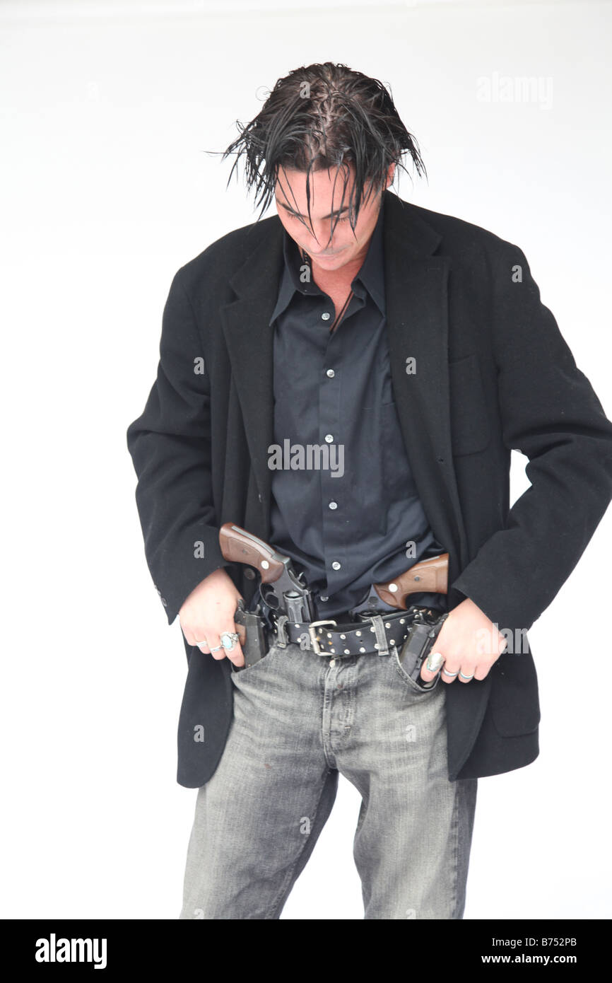 Man with guns Stock Photo - Alamy