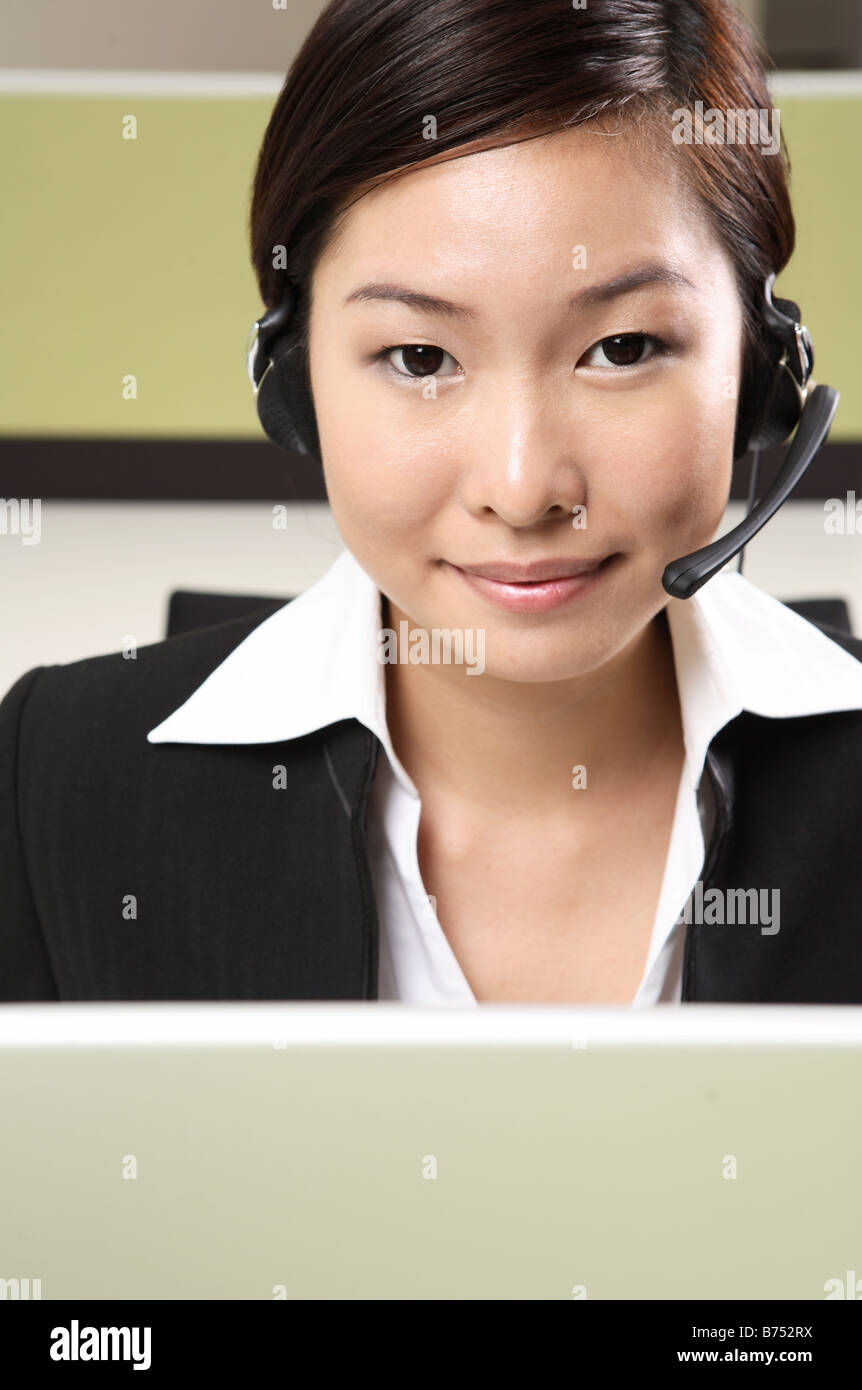 Female Asian Customer Service Representative Stock Photo - Alamy