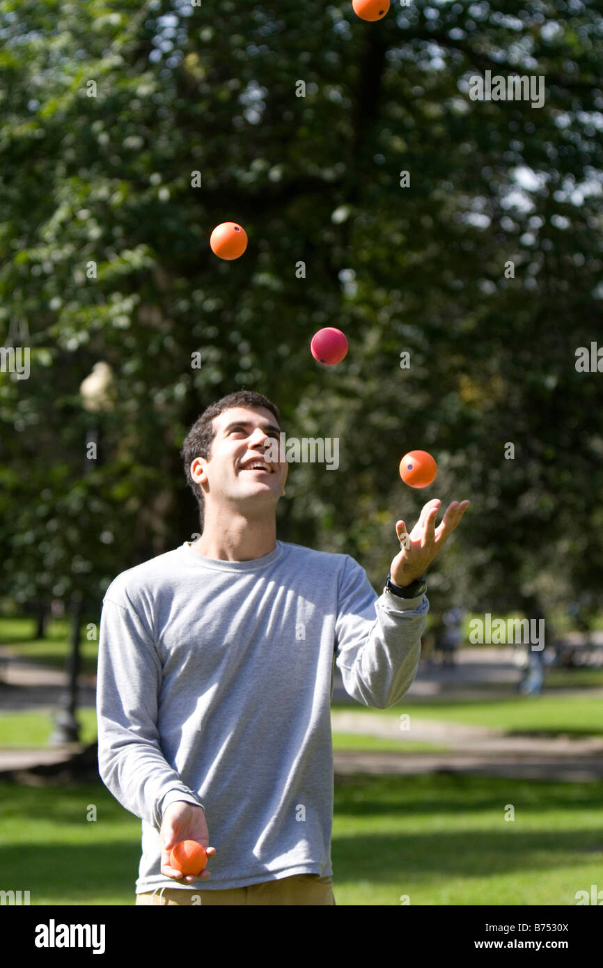 A man toss juggling balls in Boston Common public park in Boston ...