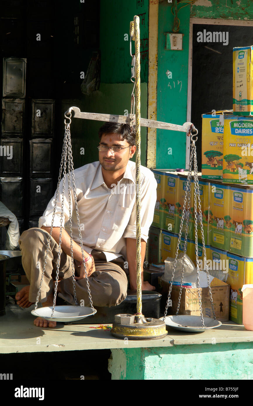 indian shopkeeper in a backstreet market of bikaner with traditional ...