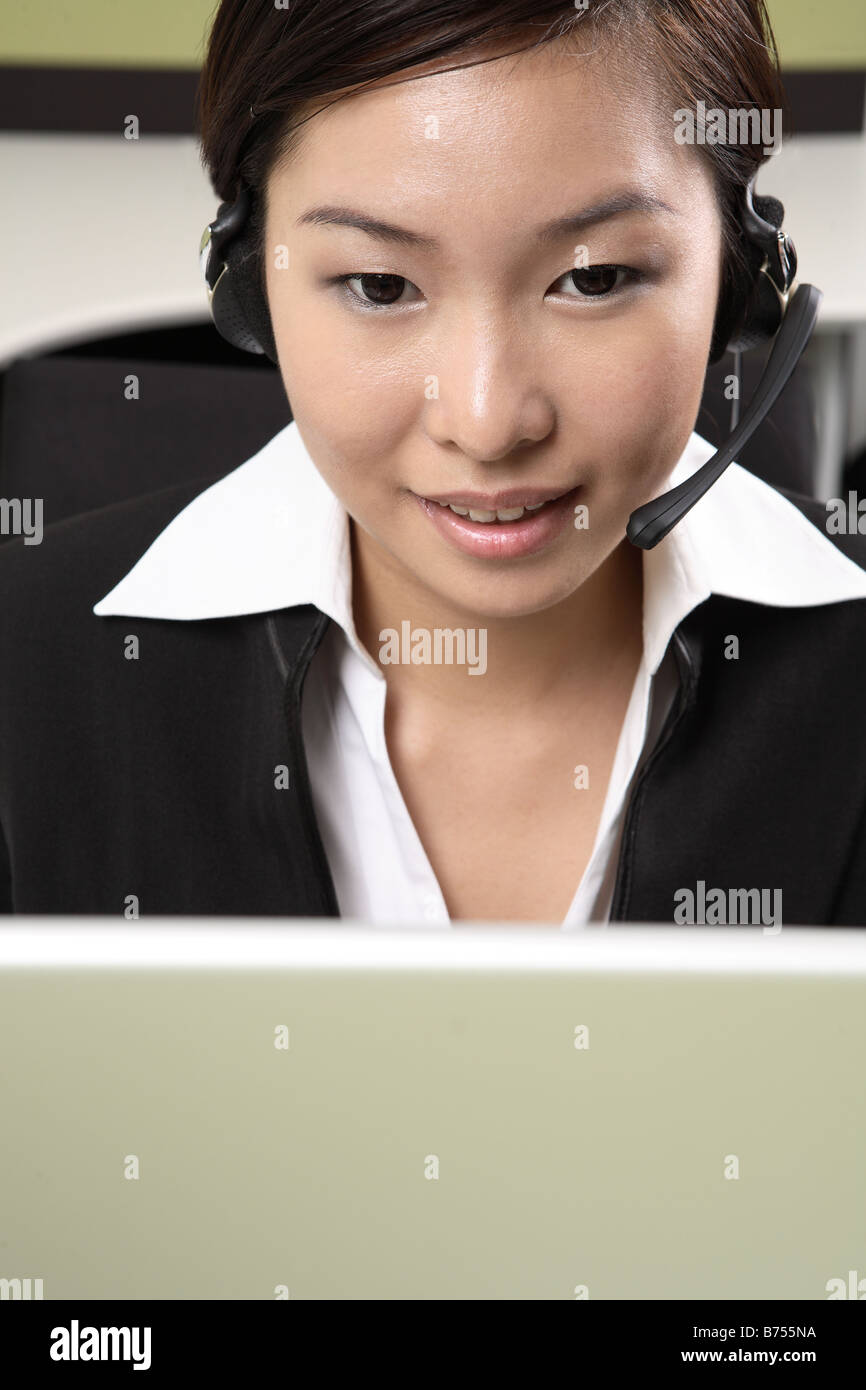 Female Asian Customer Service Representative Stock Photo - Alamy
