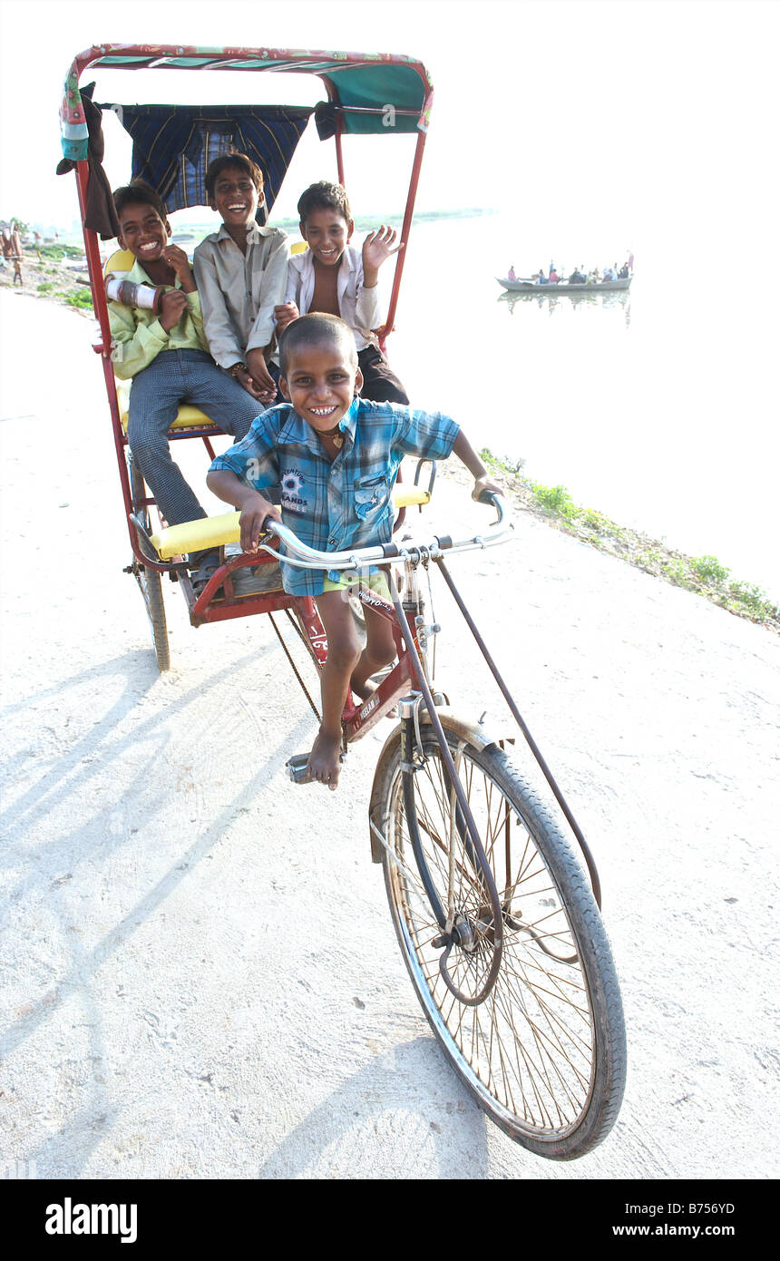 India Vrindavan boys riding a rickshaw Stock Photo - Alamy
