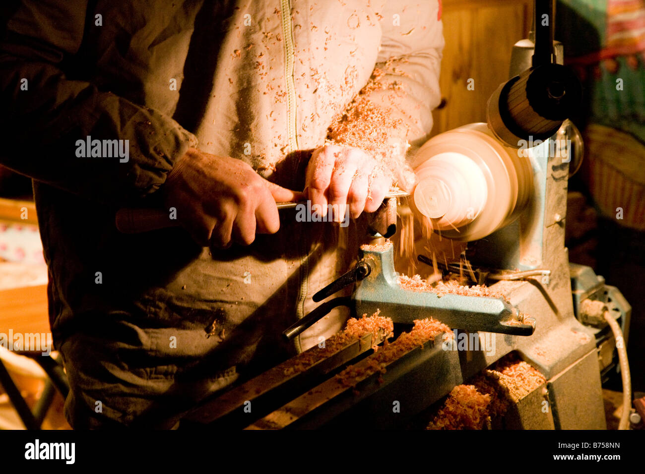 A man making ornamental wooden crafts in a Christmas market Stock Photo ...