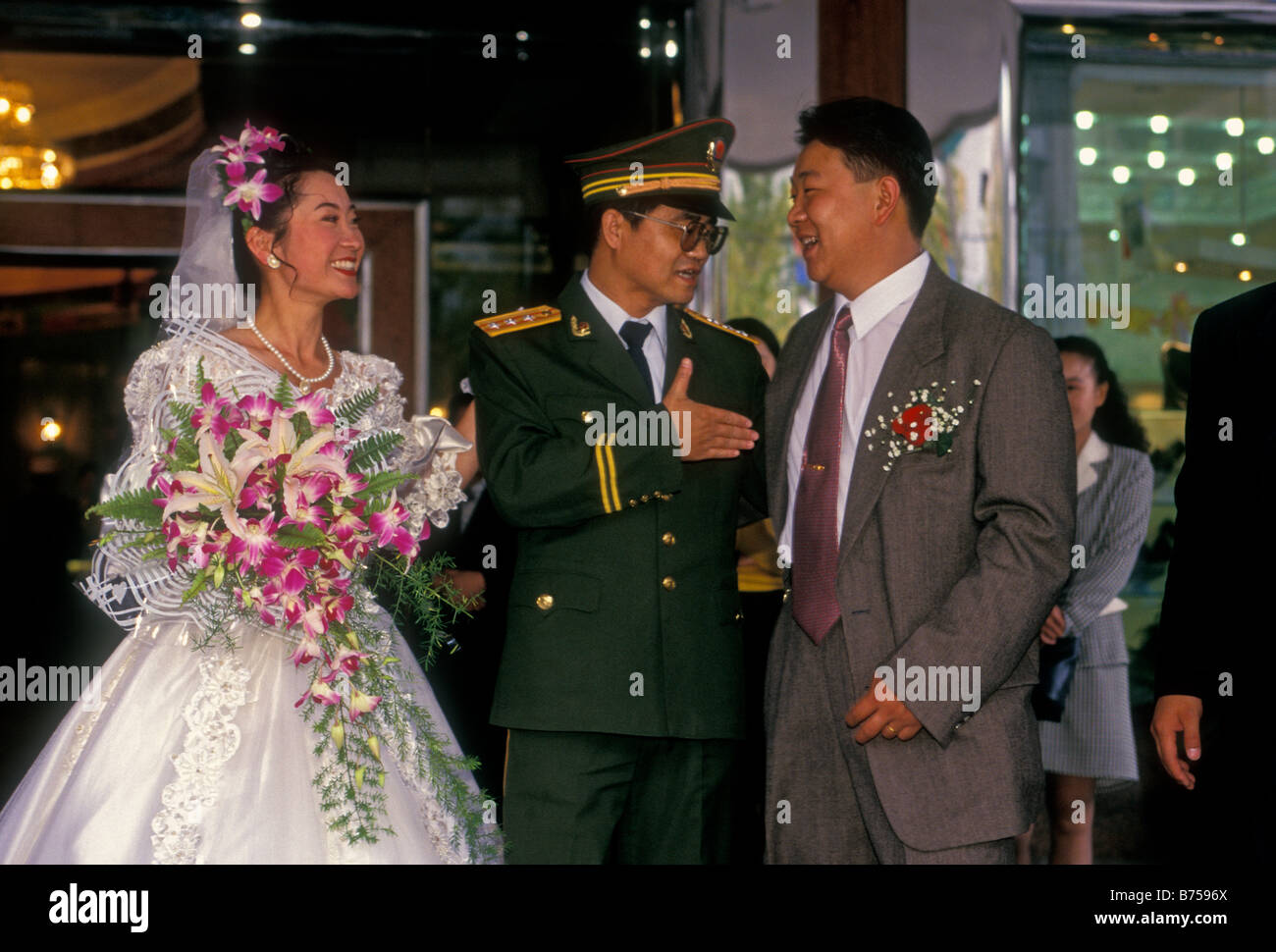Chinese bride and groom, welcoming guests, family members, Chinese ...