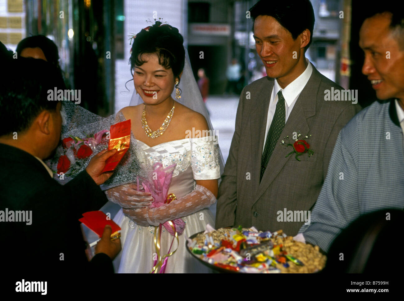 Chinese bride and groom, welcoming guests, family members, Chinese ...