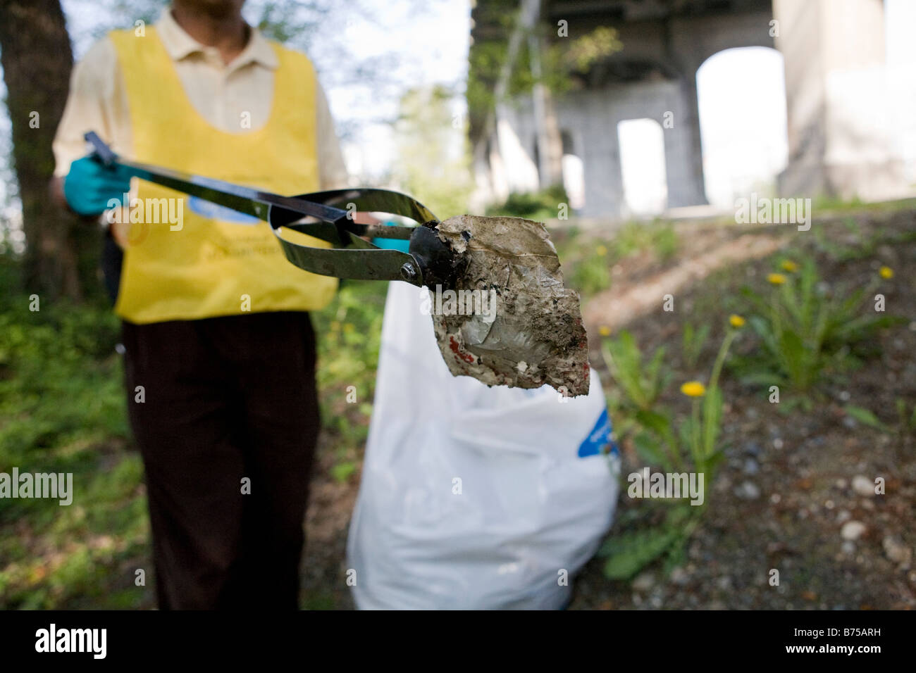 Man cleaning up under Burrard Bridge, Vancouver, Canada Stock Photo - Alamy