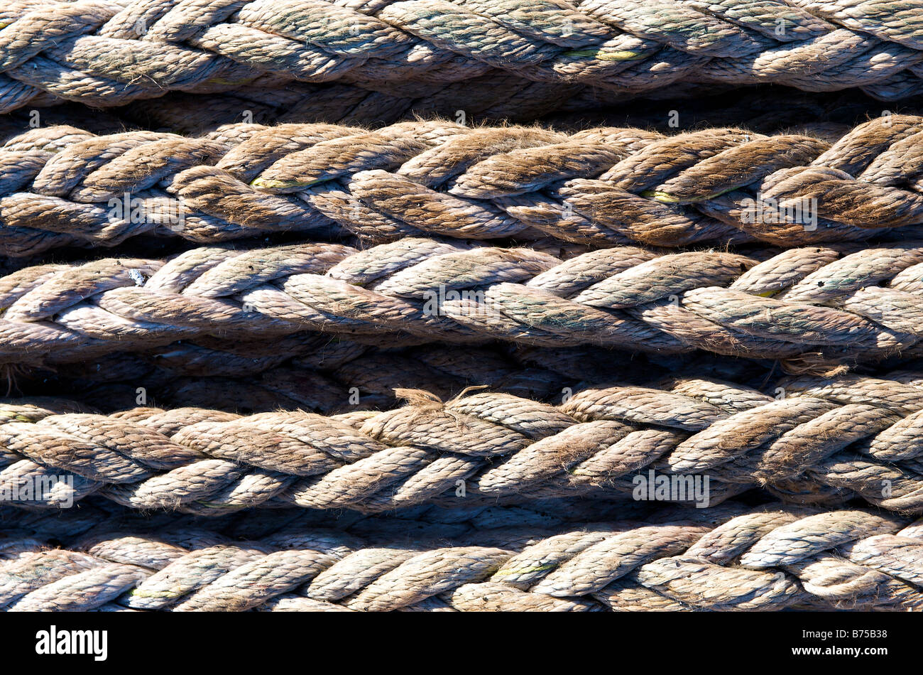 Rope used on to tie ships to the dock Stock Photo - Alamy