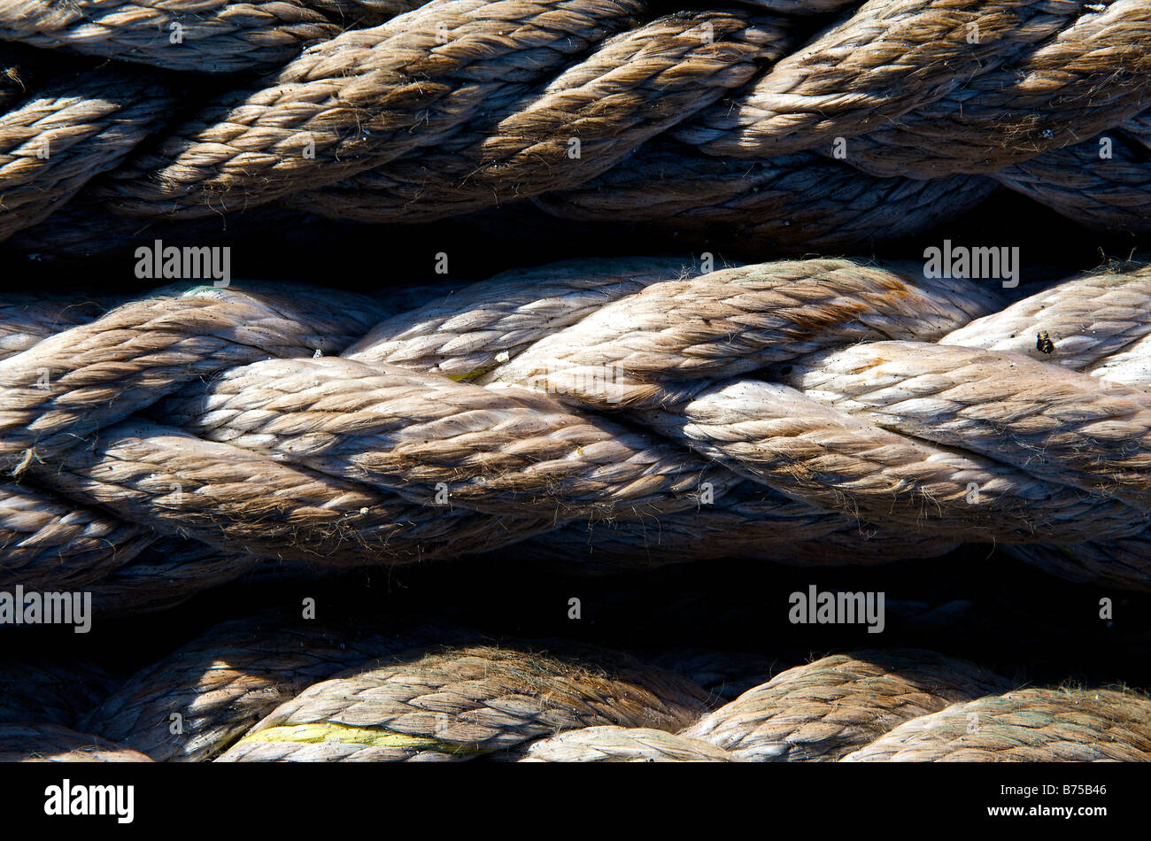 Rope used on to tie ships to the dock Stock Photo - Alamy