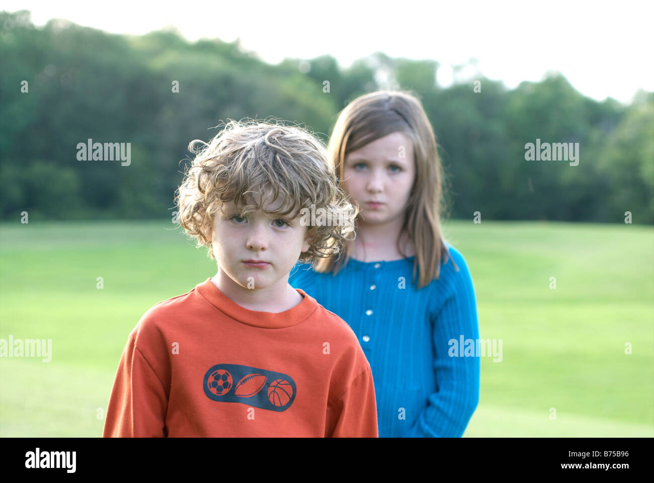 Six year old brother and 8 year old sister in park, Winnipeg, Manitoba ...