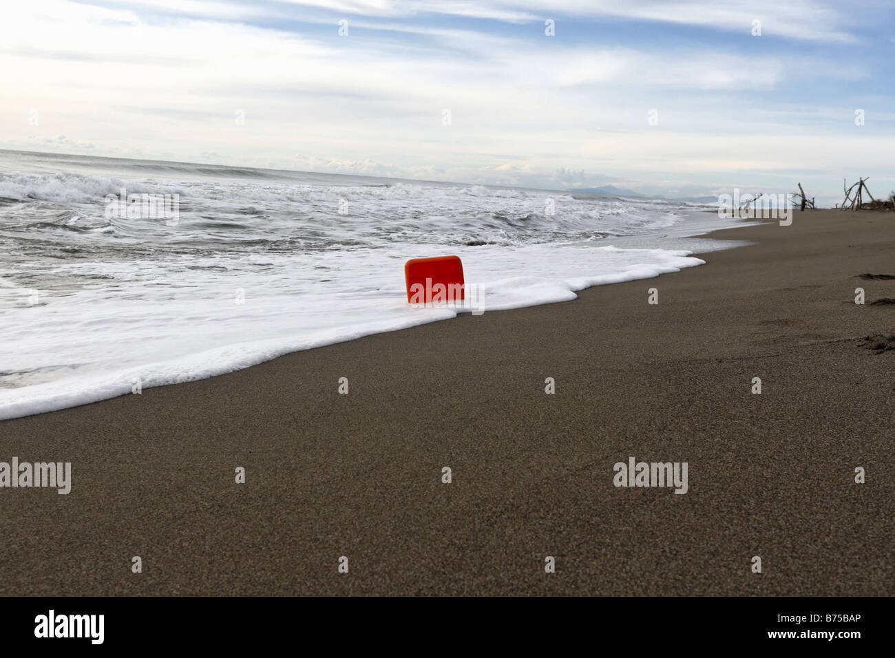 Plastic Container Washed up on Beach Stock Photo - Alamy
