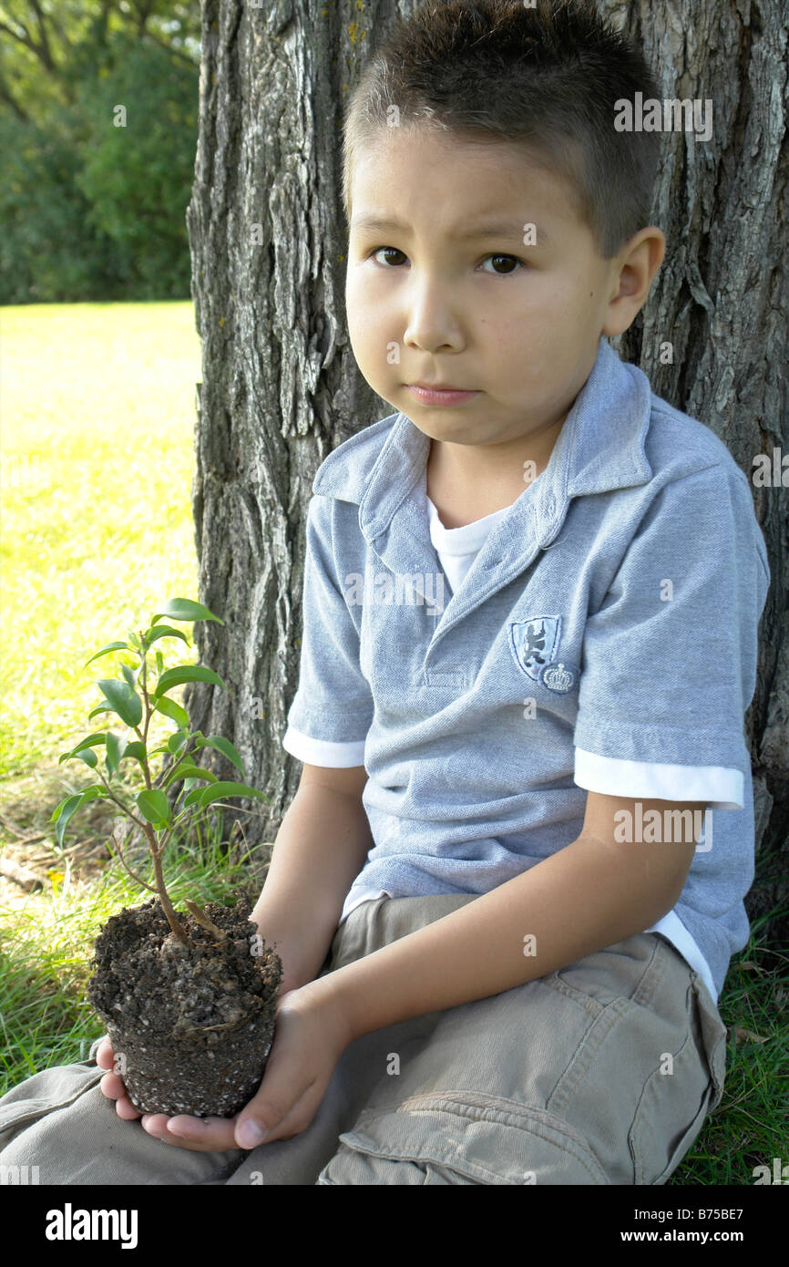 Boy boys male kids children tree hi-res stock photography and images ...