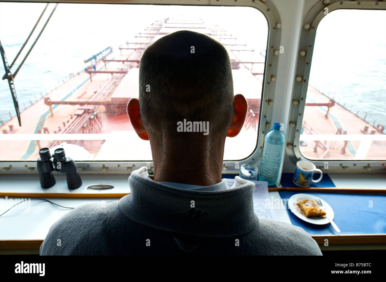 Marine pilot on the bridge of a bulk carrier Stock Photo - Alamy