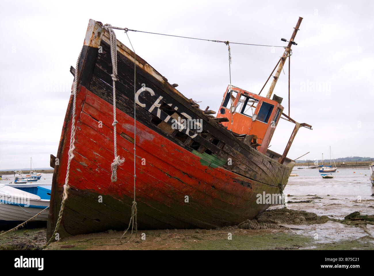 Fishing Boat, Mersea Island in Mud Stock Photo - Alamy