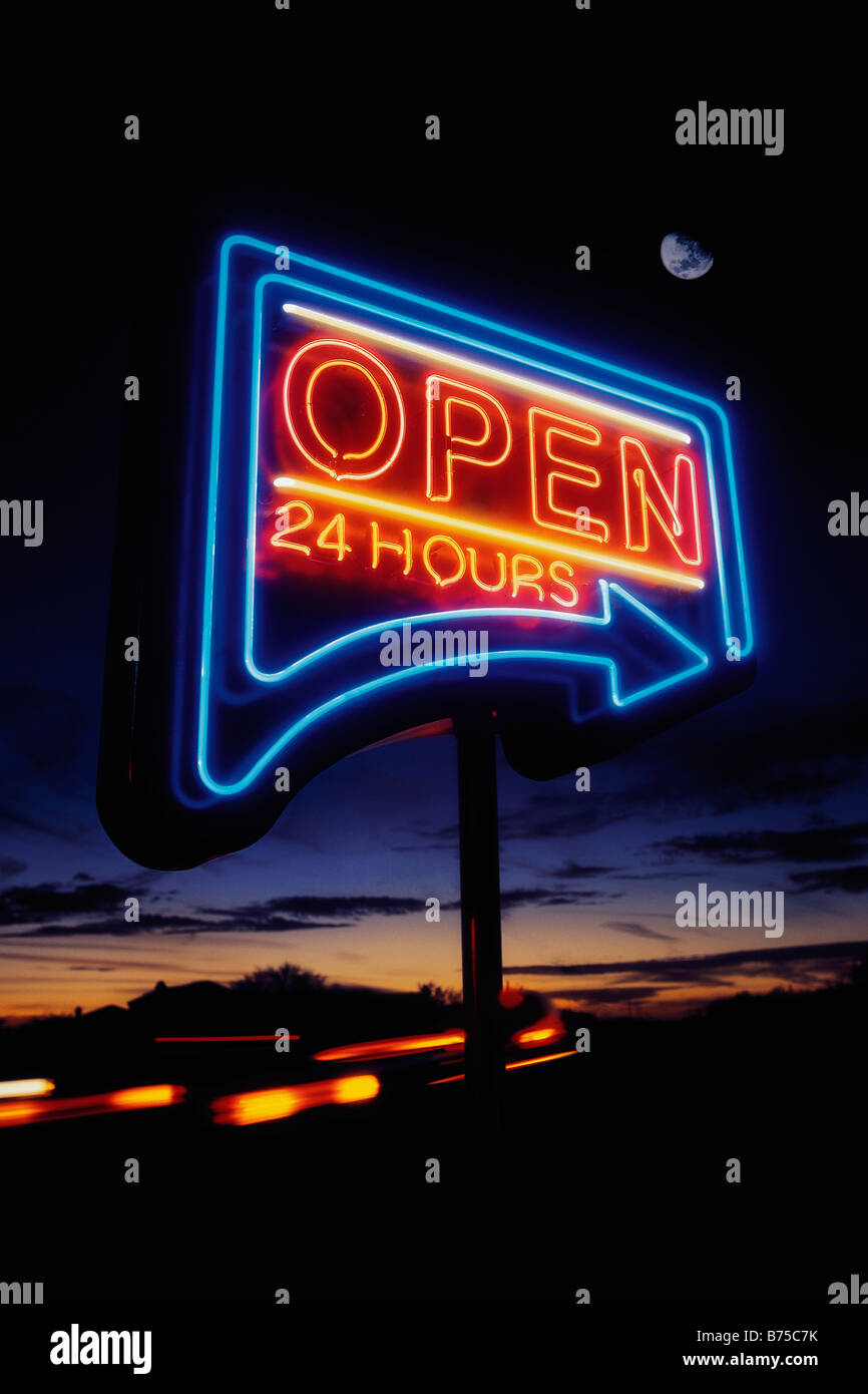 Low angle view of a signboard lit up at night Stock Photo - Alamy