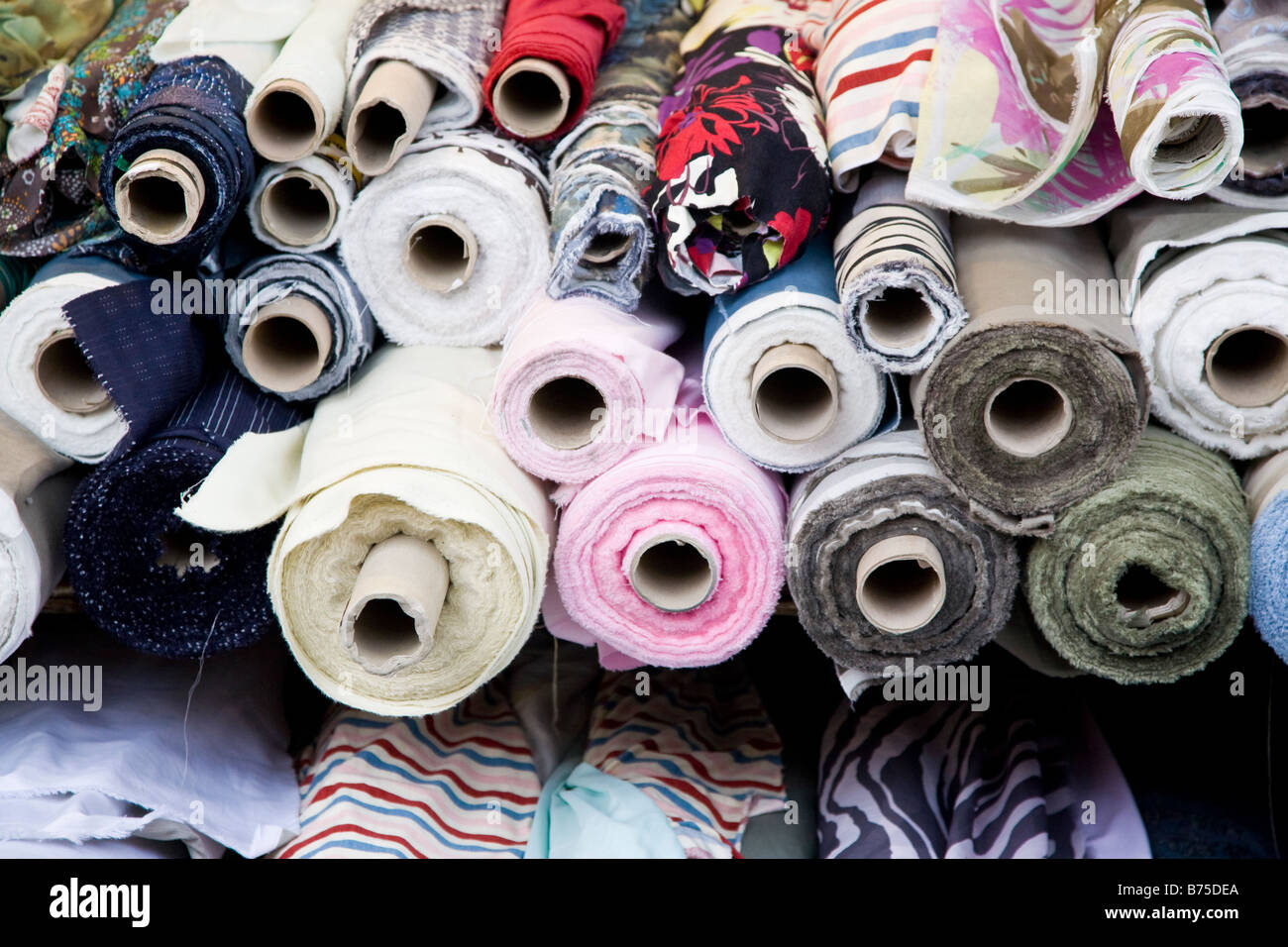 Rolls of material at a market Stock Photo - Alamy