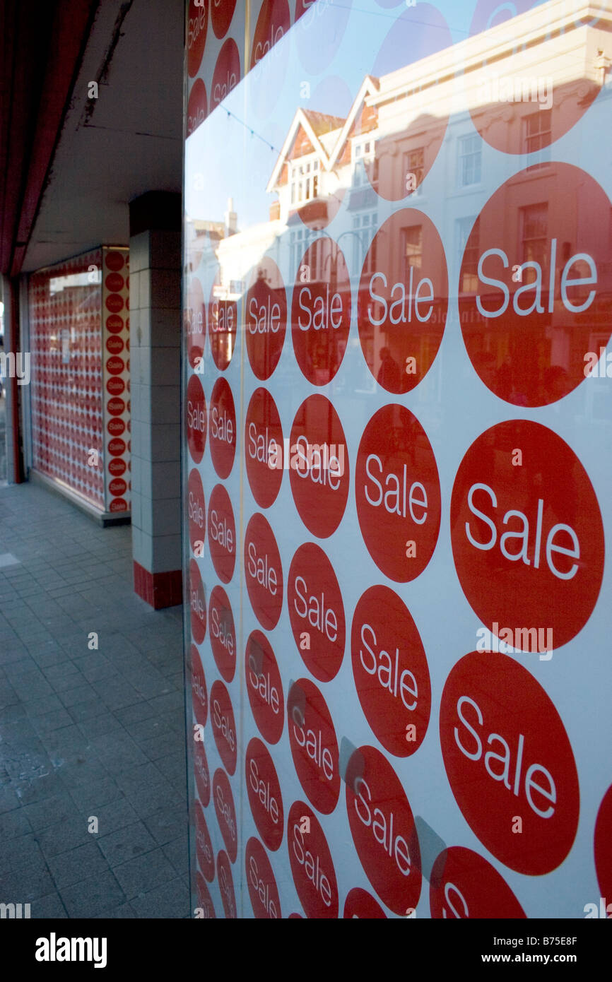 major store window display plastered with sale signs Stock Photo - Alamy